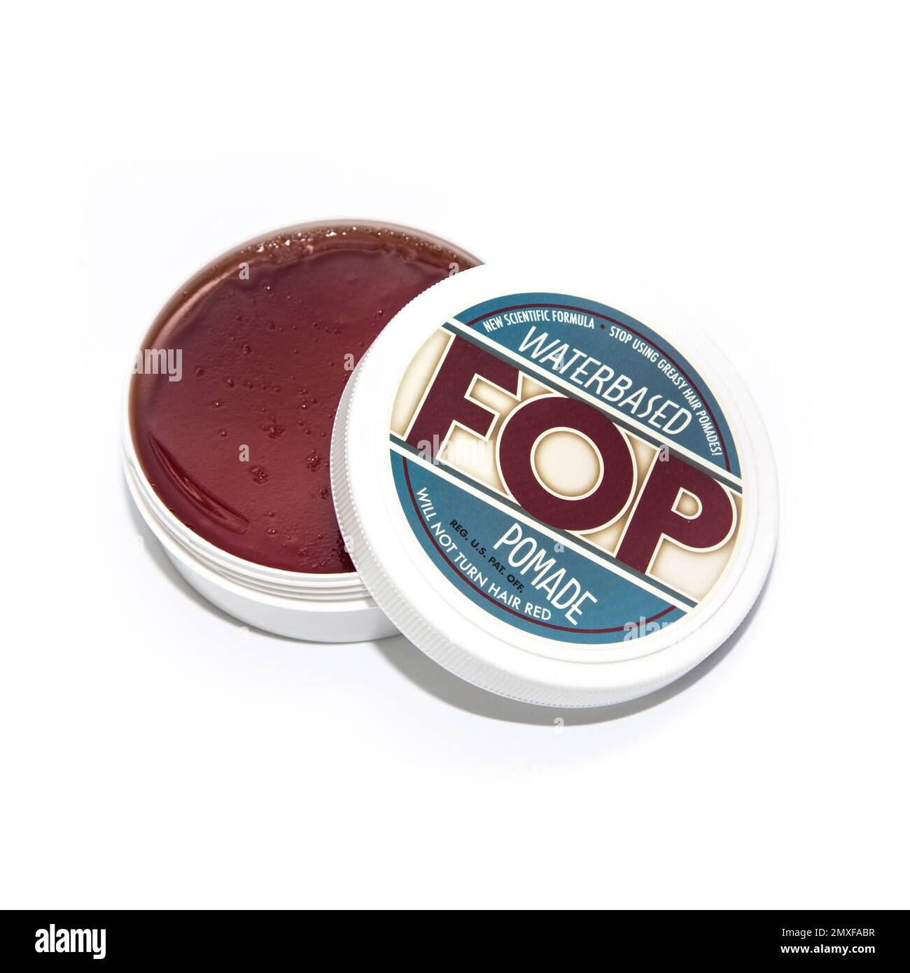 A beard and hair balm in a container on white background Stock Photo ...