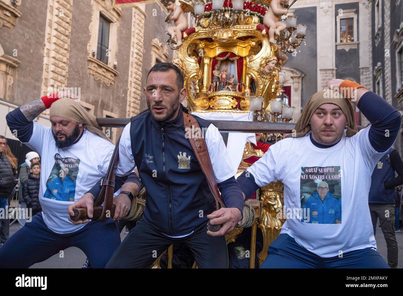 People seen carrying a traditional Candelora on the streets of Catania ...