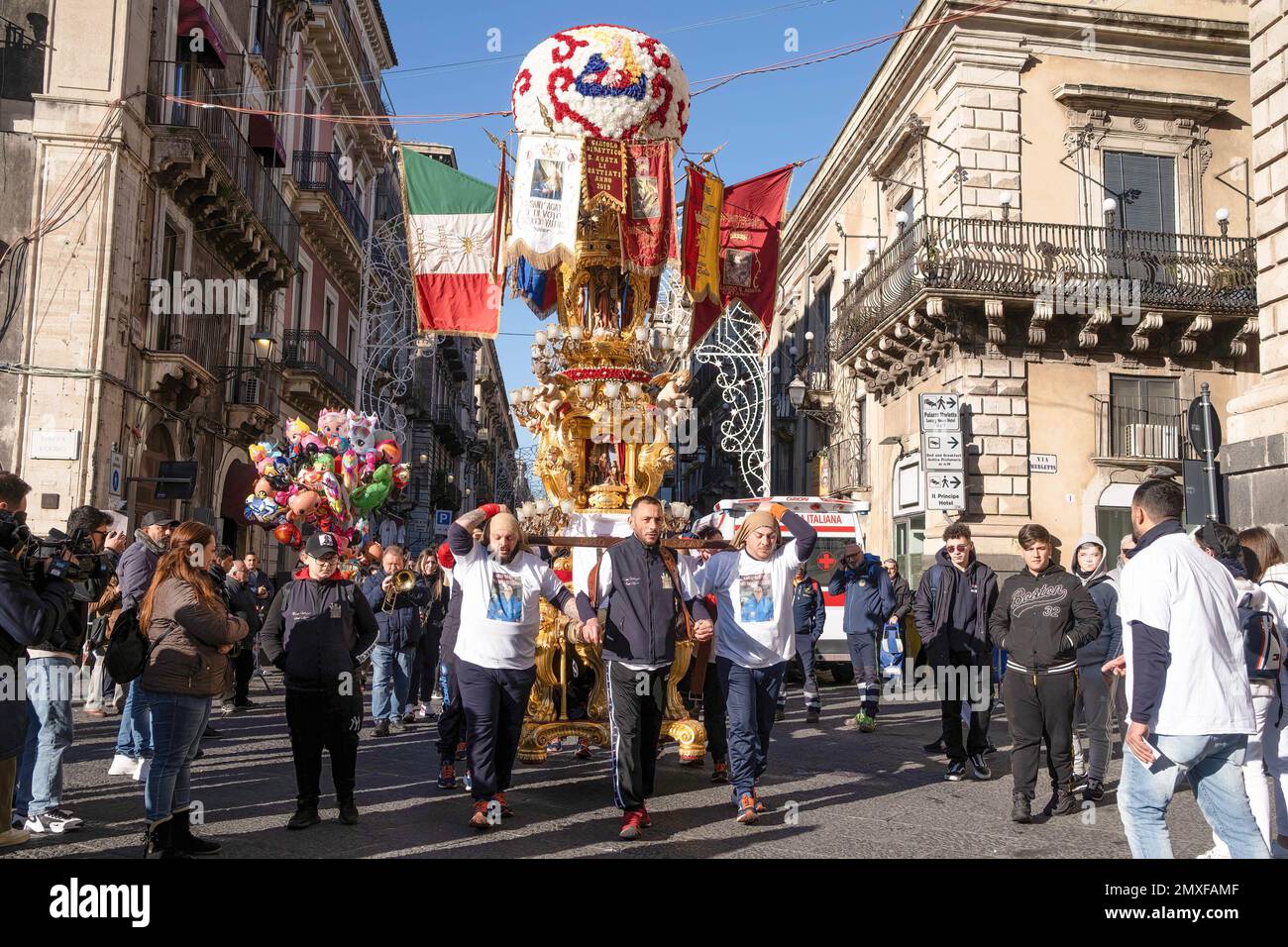 People seen carrying a traditional candelora on the streets of Catania ...