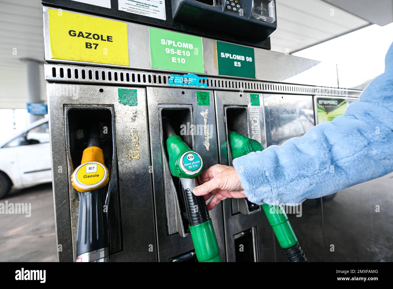 Illustration picture shows a person using a petrol pump (unleaded fuel ...