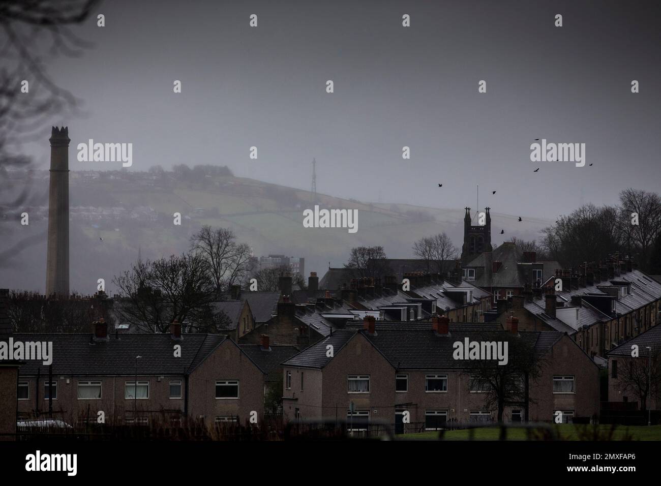 Rows of poor quality terraced houses and council houses in the shadow ...