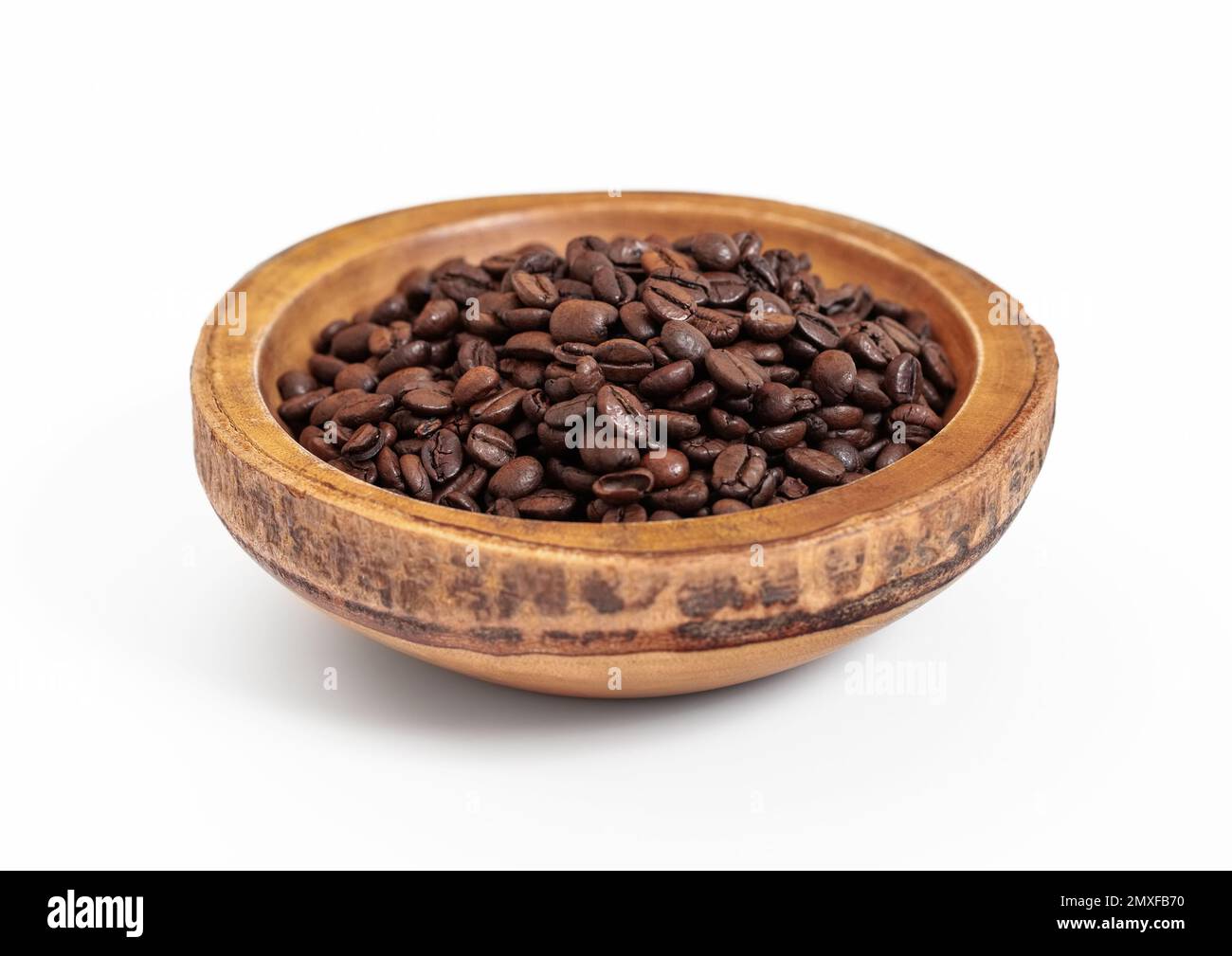 Wooden bowl plate with fresh raw aroma coffee beans on white Stock ...