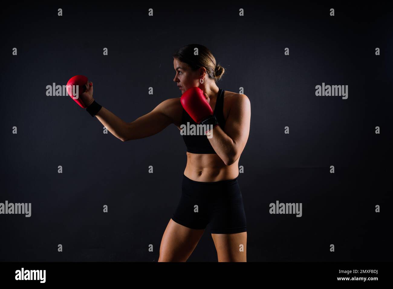 Young woman athletic female MMA fighter training. Concept of sport ...