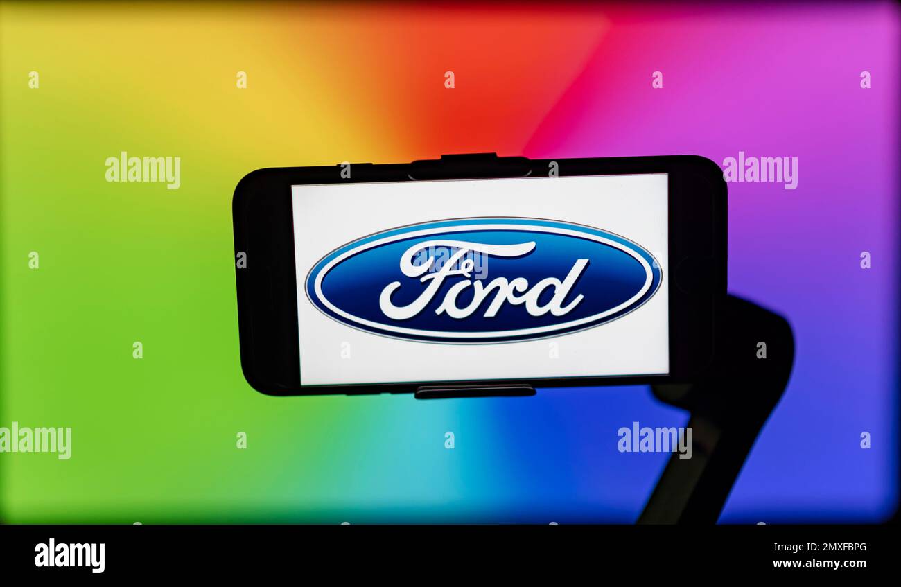 In this photo illustration, the Ford logo is seen displayed on a mobile ...
