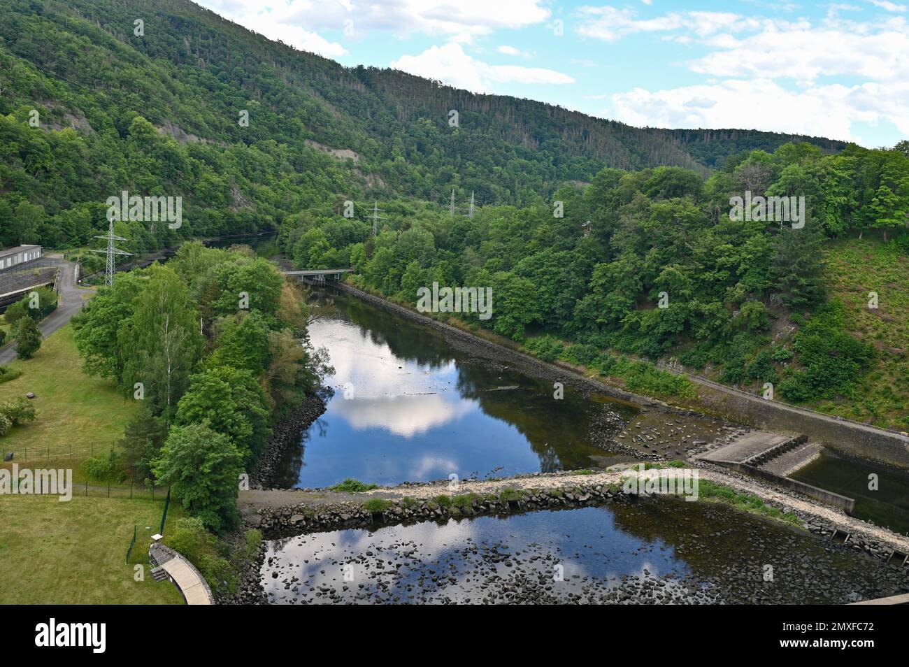 View from the Edertalsperre to the river Eder with power poles Stock ...