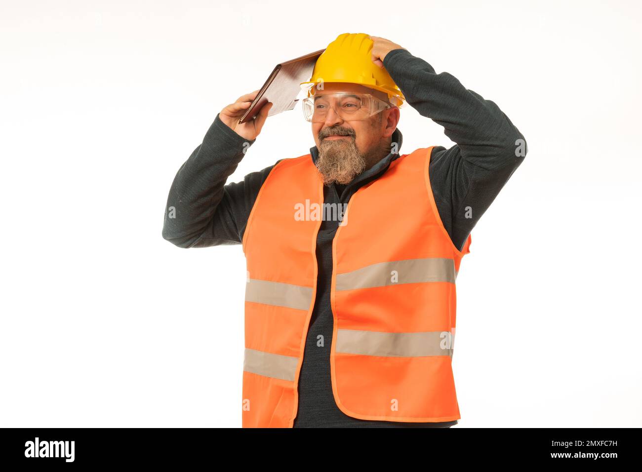 A frustrated caucasian construction manager with hands on head on white ...