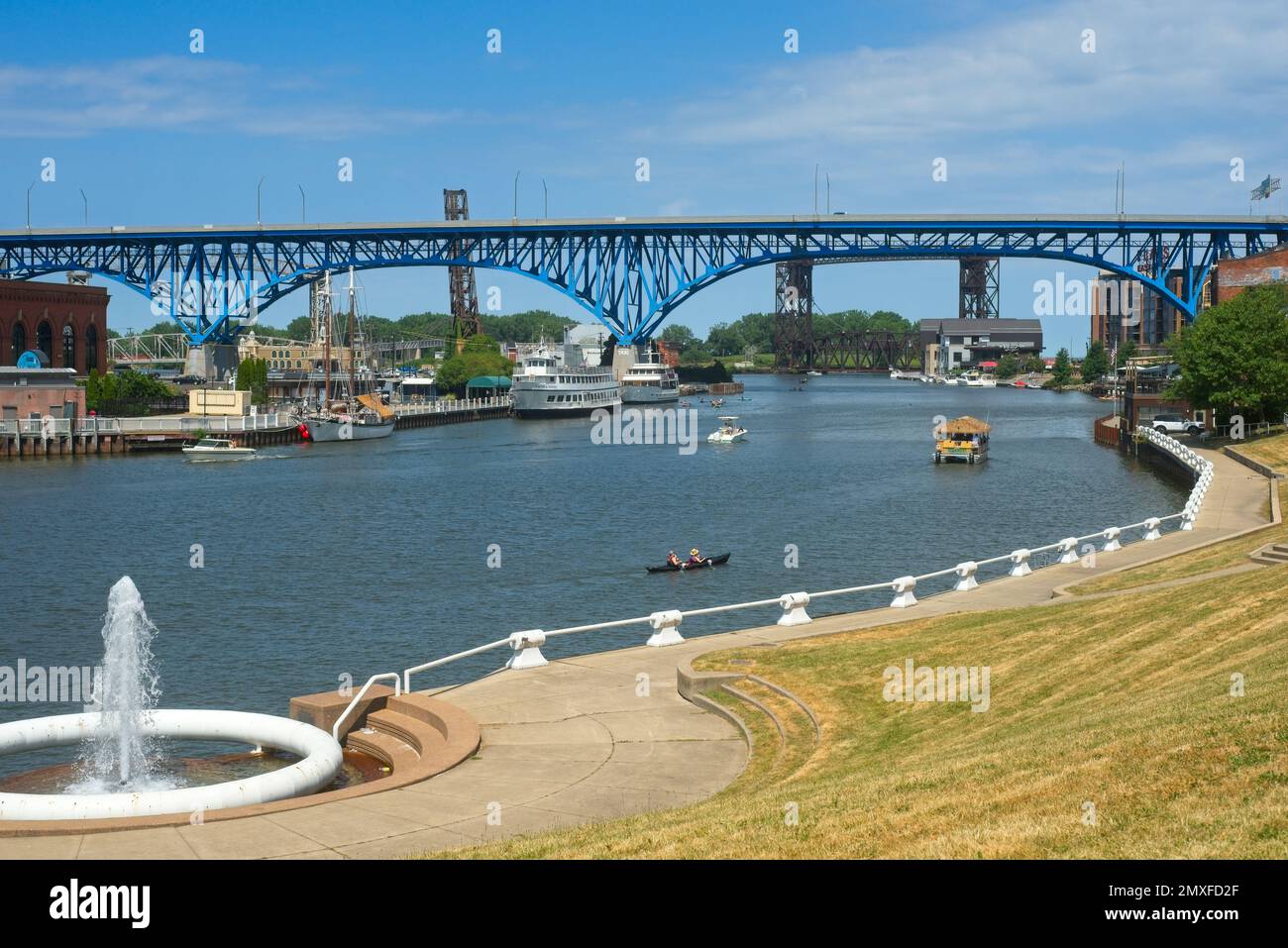Boats of various kinds, including a thatch-roofed tiki barge and kayaks ...