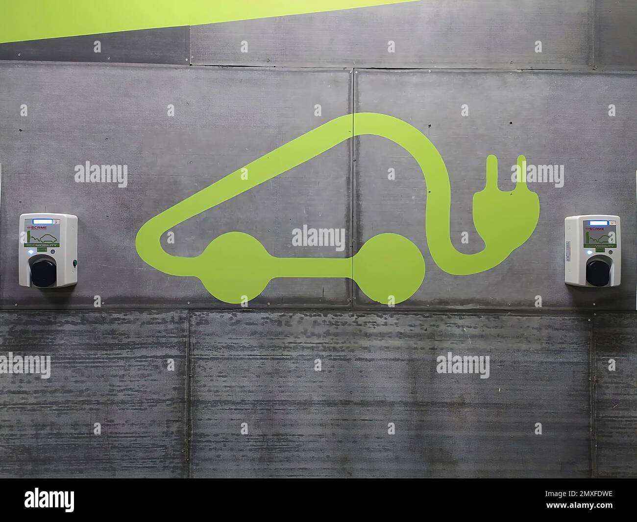 Electric car charging symbol in a parking lot with two sockets Stock ...