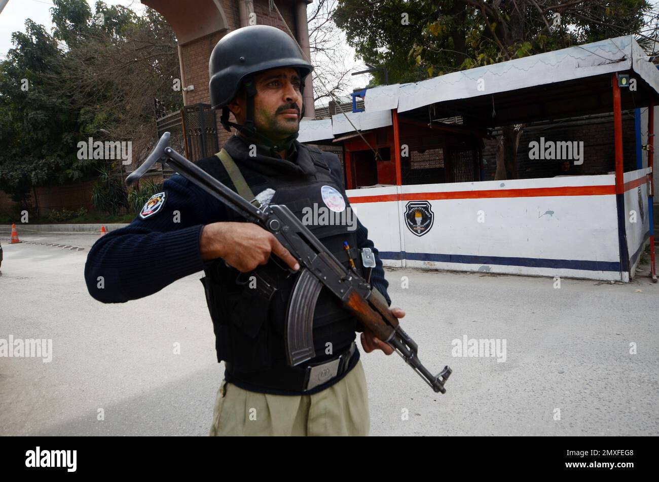 PESHAWAR PAKISTAN, JANURAY, 01: A policeman searches a man at the entry ...