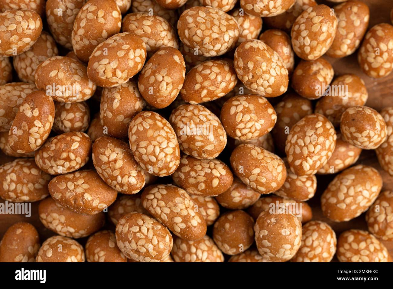 A Background of Crunchy Asian Sesame Peanuts with Soy Sauce Stock Photo ...