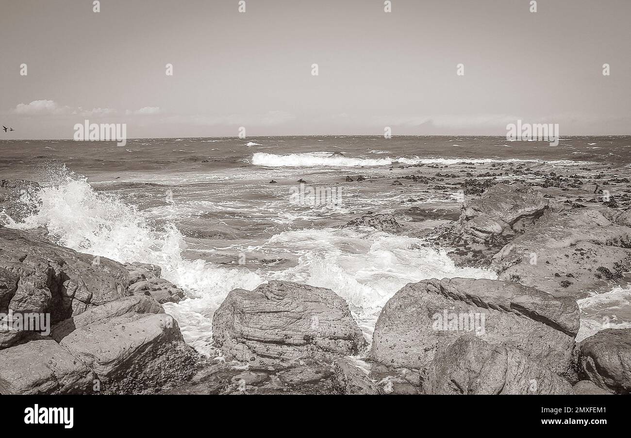 False Bay rough coast landscape with boulders waves and mountains with ...