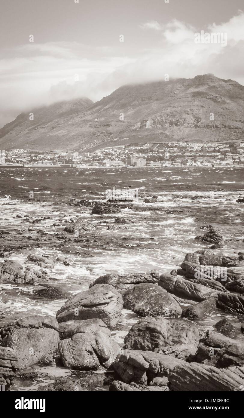 False Bay rough coast landscape with boulders waves and mountains with ...