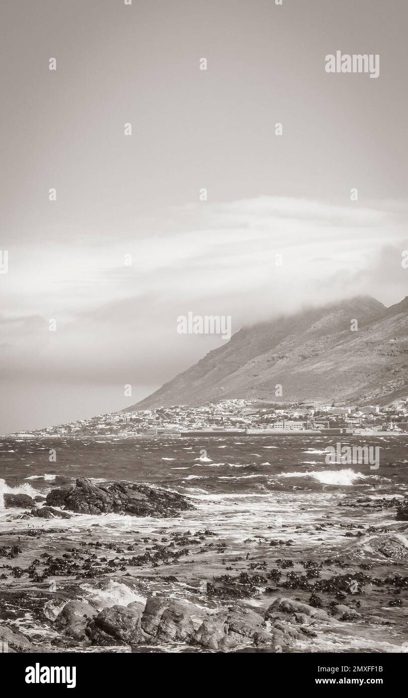 False Bay rough coast landscape with boulders waves and mountains with ...