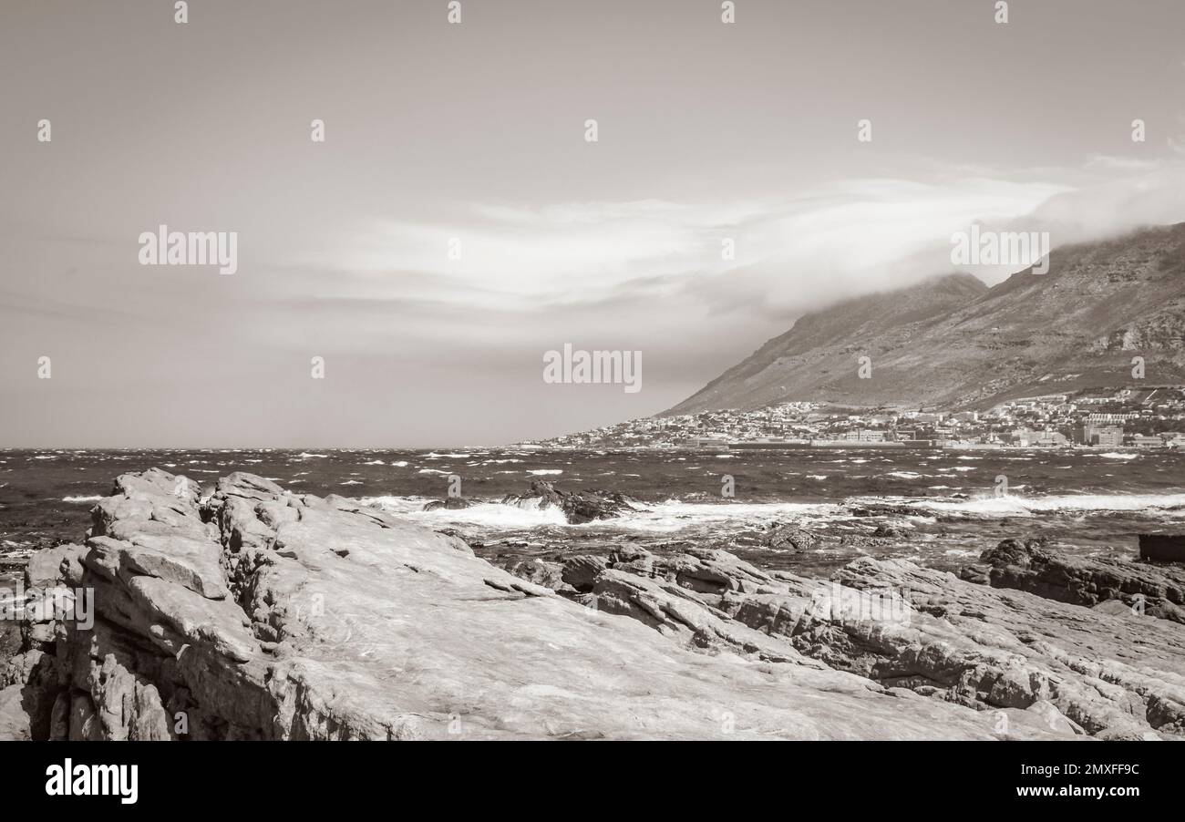 False Bay rough coast landscape with boulders waves and mountains with ...