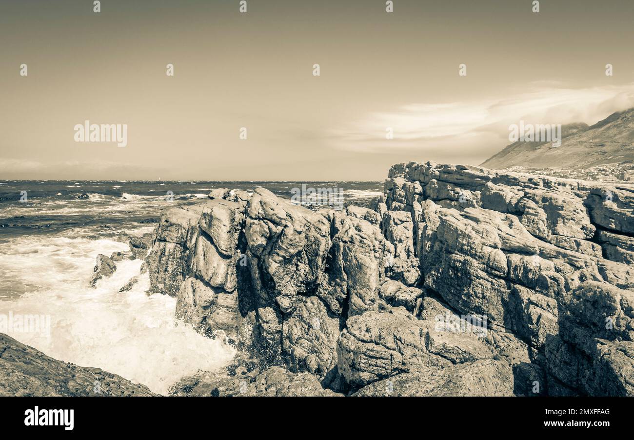False Bay rough coast landscape with boulders waves and mountains with ...