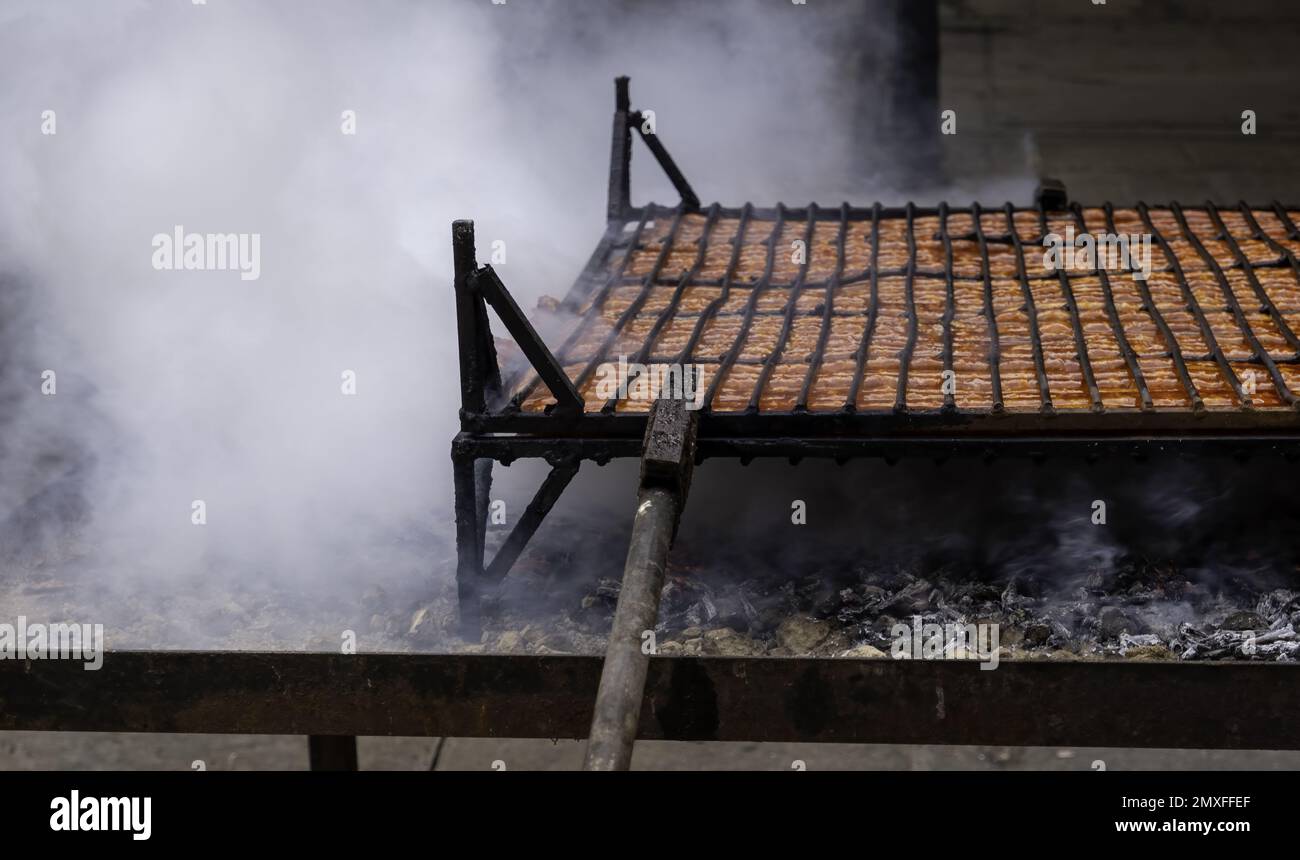 Detail of fire roasted pork, traditional festival Stock Photo - Alamy