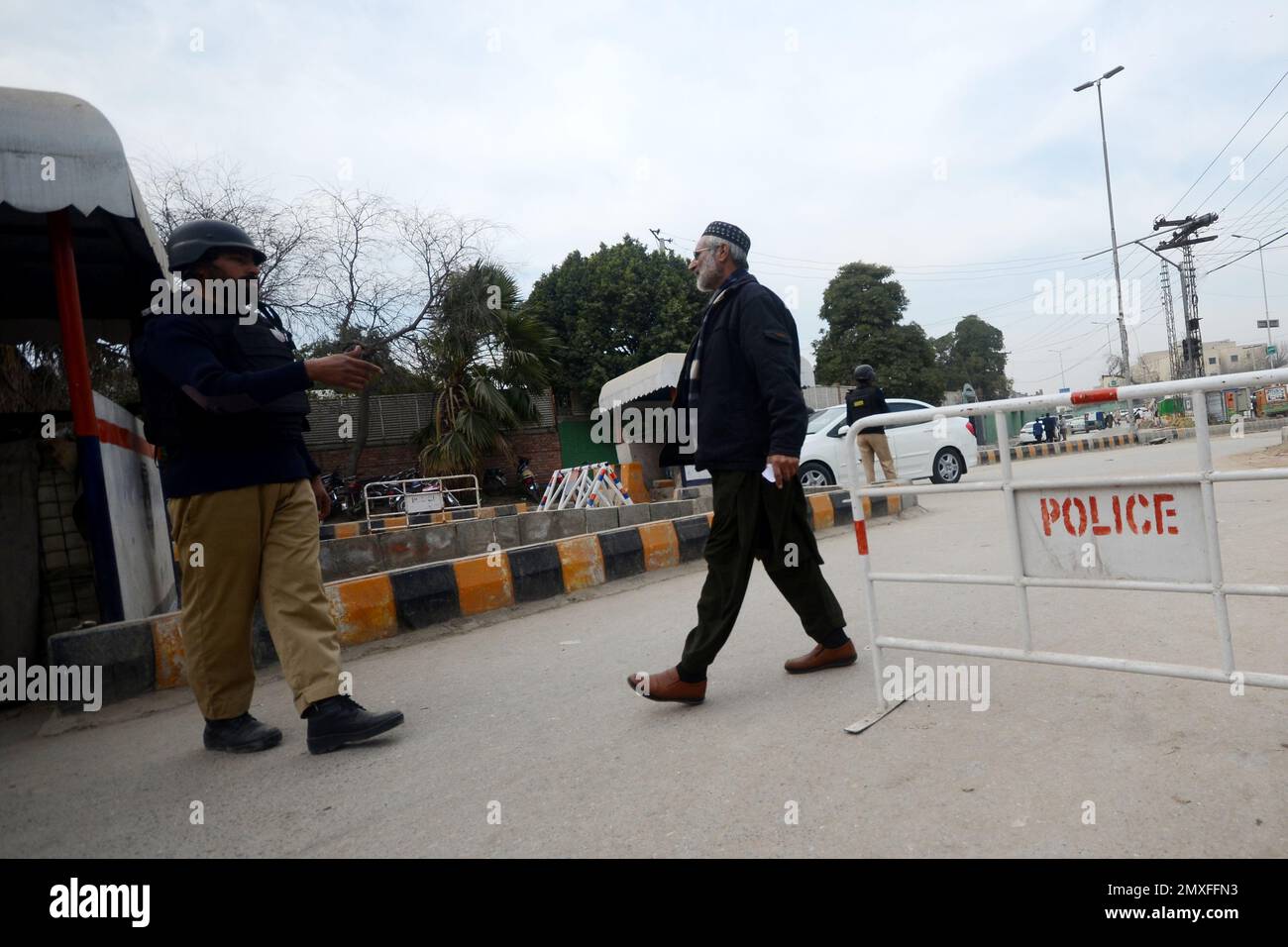 PESHAWAR PAKISTAN, JANURAY, 01: A policeman searches a man at the entry ...