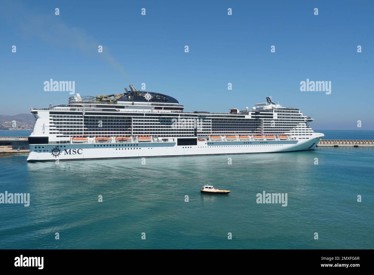 MSC Virtuosa in port of Malaga during summer. Passenger ship is a ...