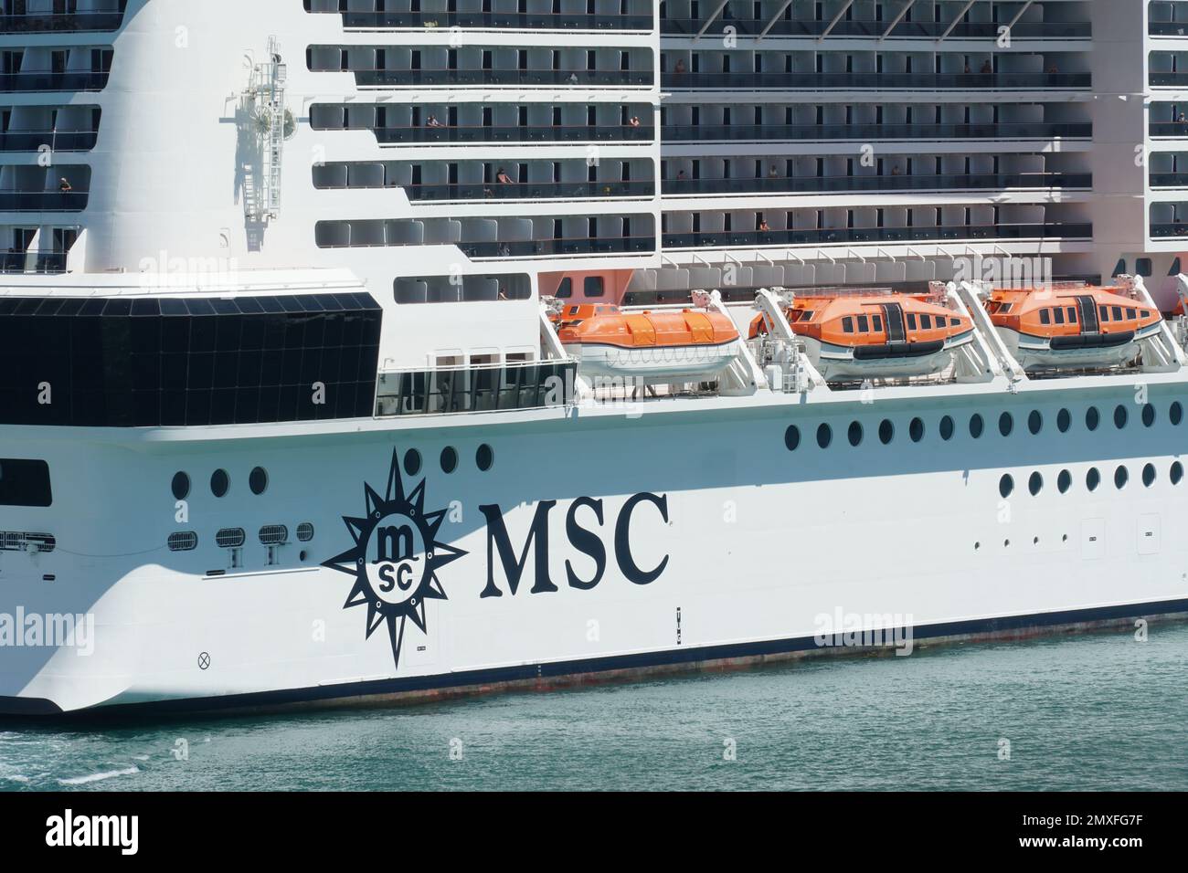 Close view on aft part and starboard side of white painted passenger ...