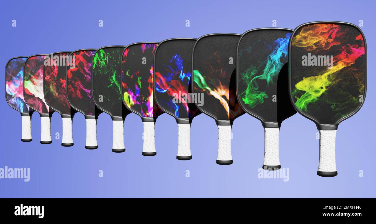 Pickleball different rackets lined up on an isolated background. Close ...