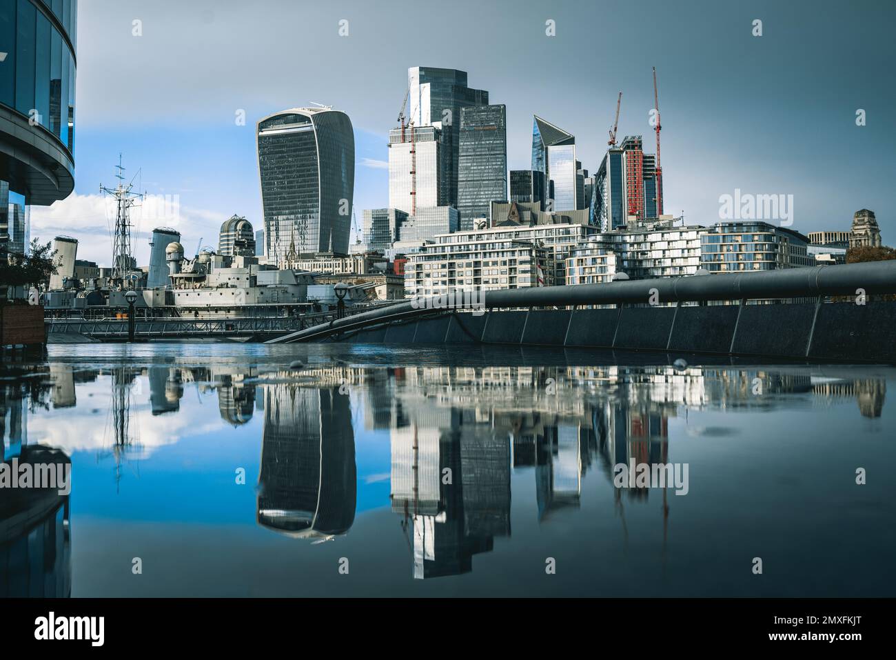 The cityscape of London with many modern skyscrapers reflected in the ...