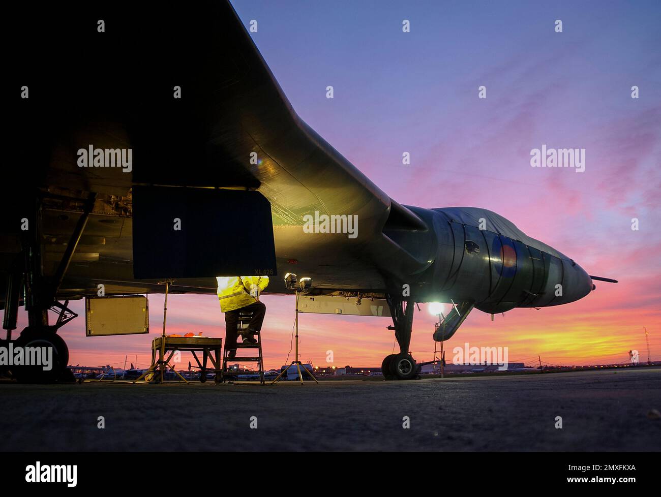 A volunteer working on preserved ex RAF Cold War Avro Vulcan B2 nuclear ...