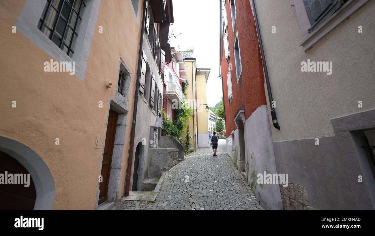European street man walking alone on empty street Stock Photo - Alamy