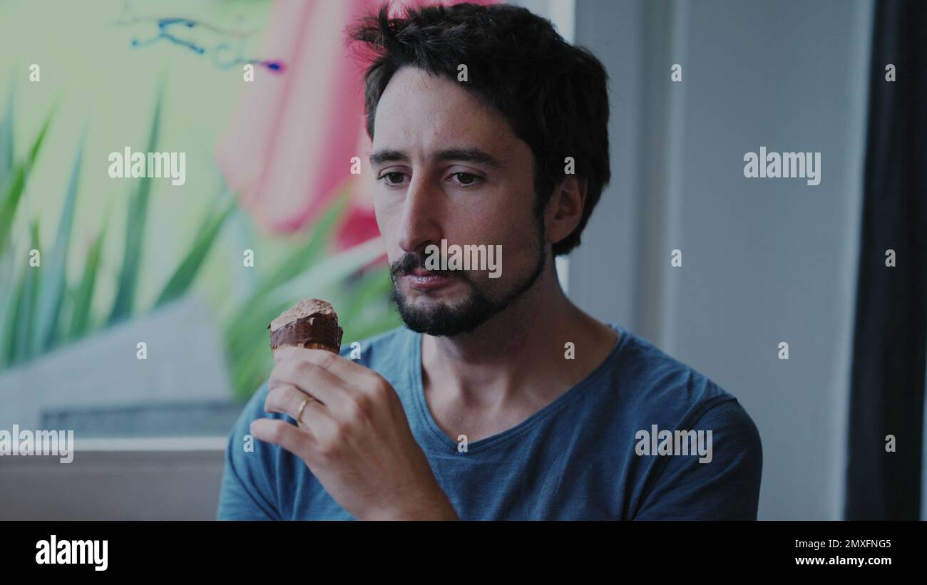 Candid person eating icecream dessert during summer season Stock Photo ...