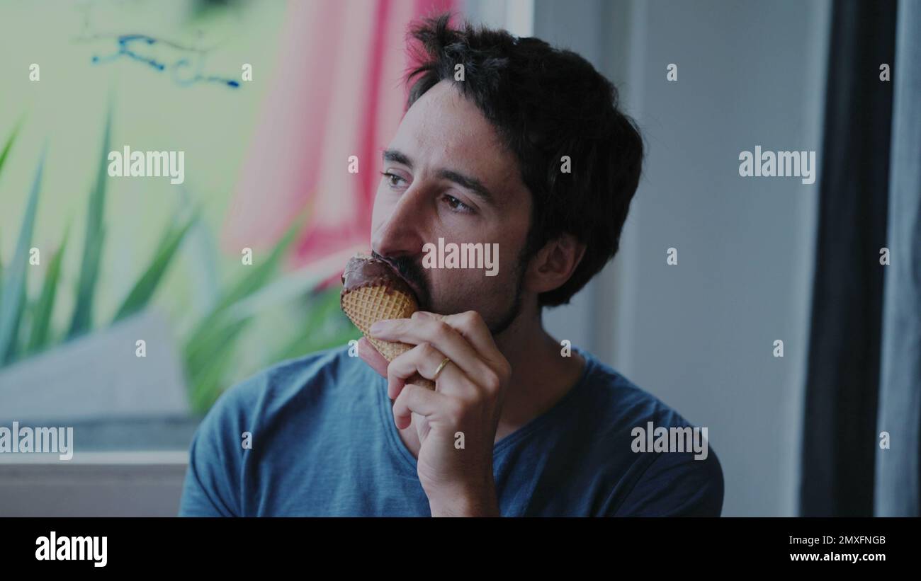 Candid person eating icecream man hi-res stock photography and images ...