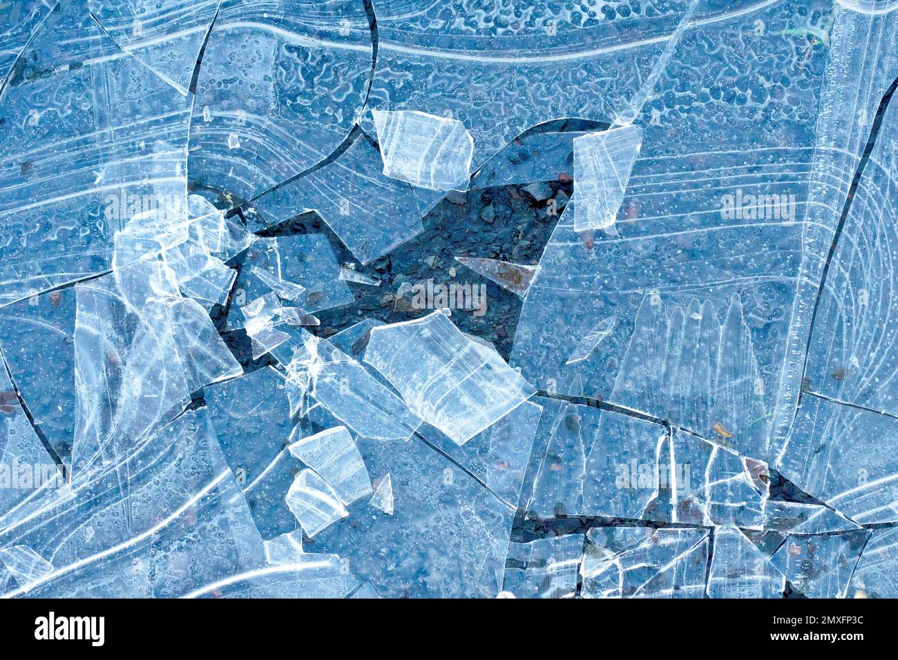 Close up showing the cracked and broken surface of an ice covered ...