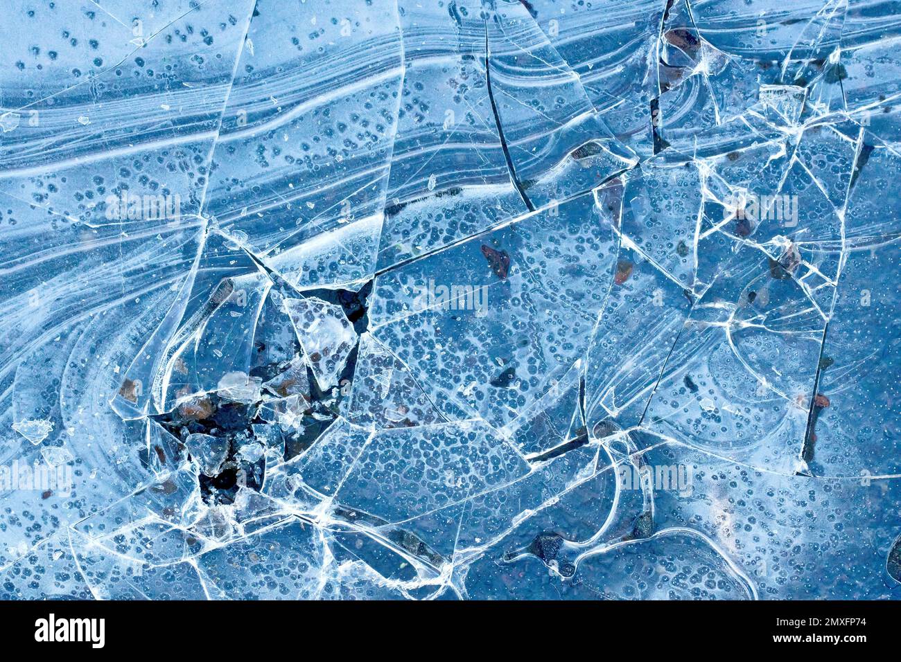 Close up showing the cracked and broken surface of an ice covered ...