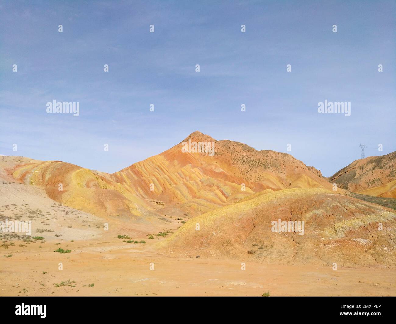 The colorful mountains in Danxia Landform on a sunny day in the ...