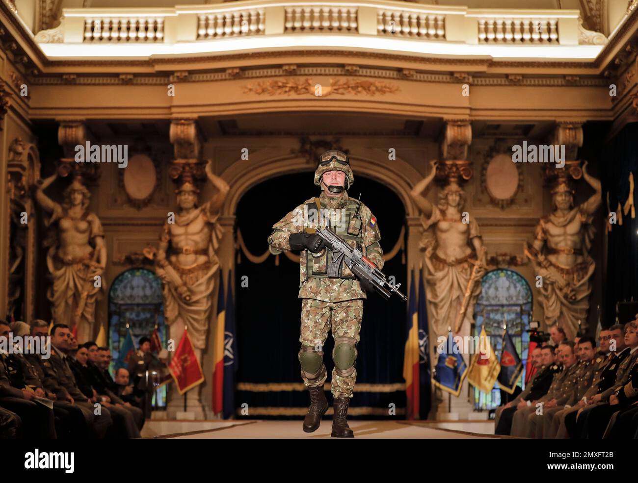 A member of the Romanian armed forces presents one the future combat ...