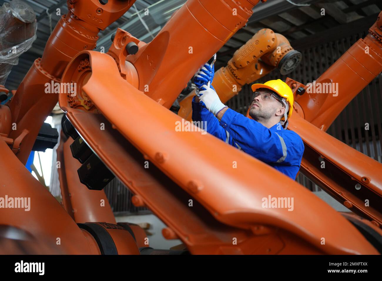 Engineer check and control welding robotics automatic arms machine in ...