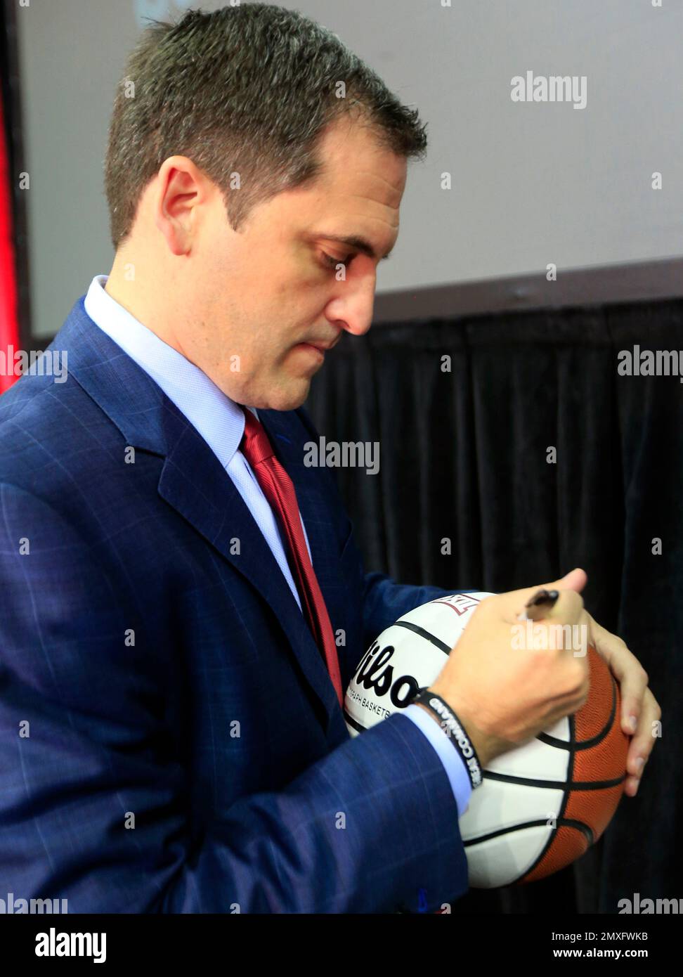 Iowa State coach Steve Prohm autographs a ball during Big 12 NCAA ...