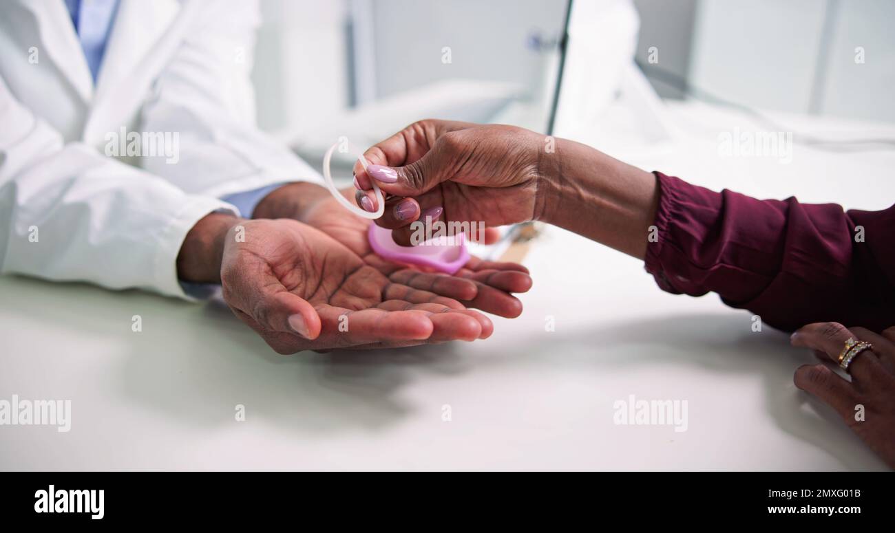 Gynecologist Consulting Woman On Diaphragm Contraception And Birth ...