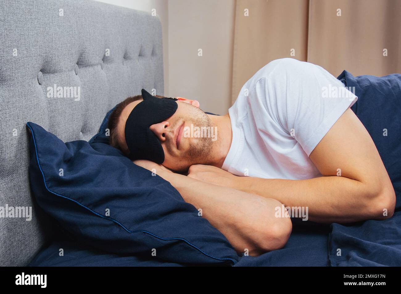 Man sleeping wearing eye mask hi-res stock photography and images - Alamy
