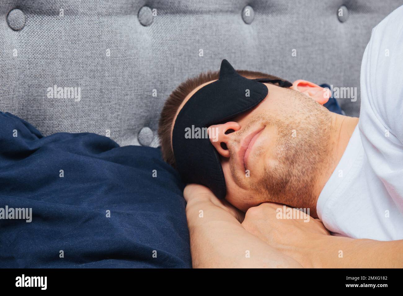 Wearing sleep mask hi-res stock photography and images - Alamy