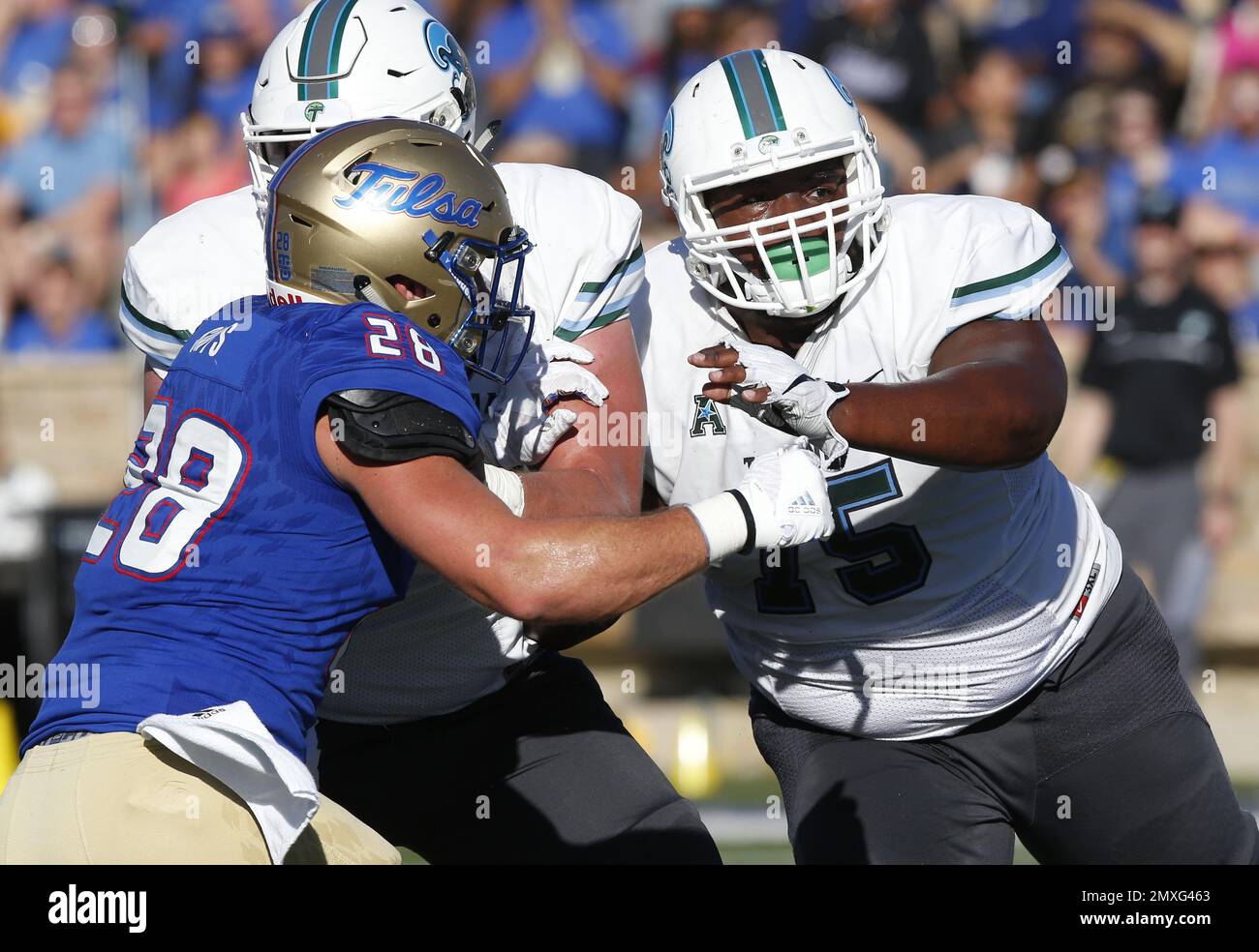 Tulane guard Chris Taylor (75) is pictured with Tulsa linebacker Craig ...