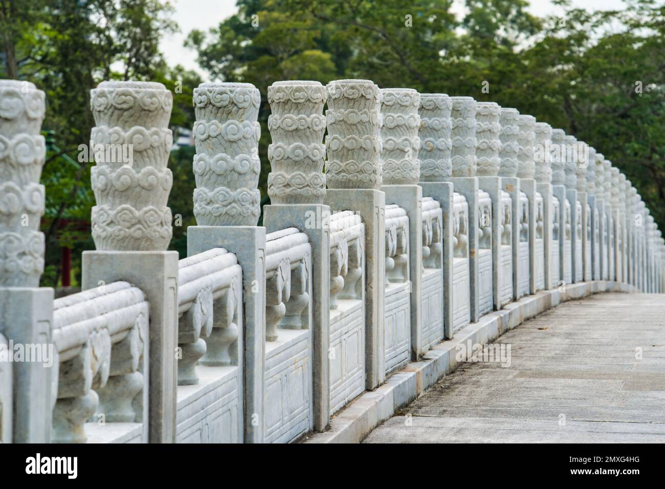 A scenic view of traditional Chinese marble pillars on a bridge Stock ...