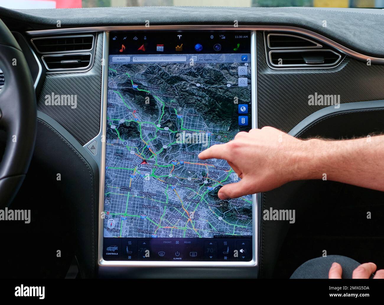 A marketing salesperson demonstrates the Google Map function on the ...