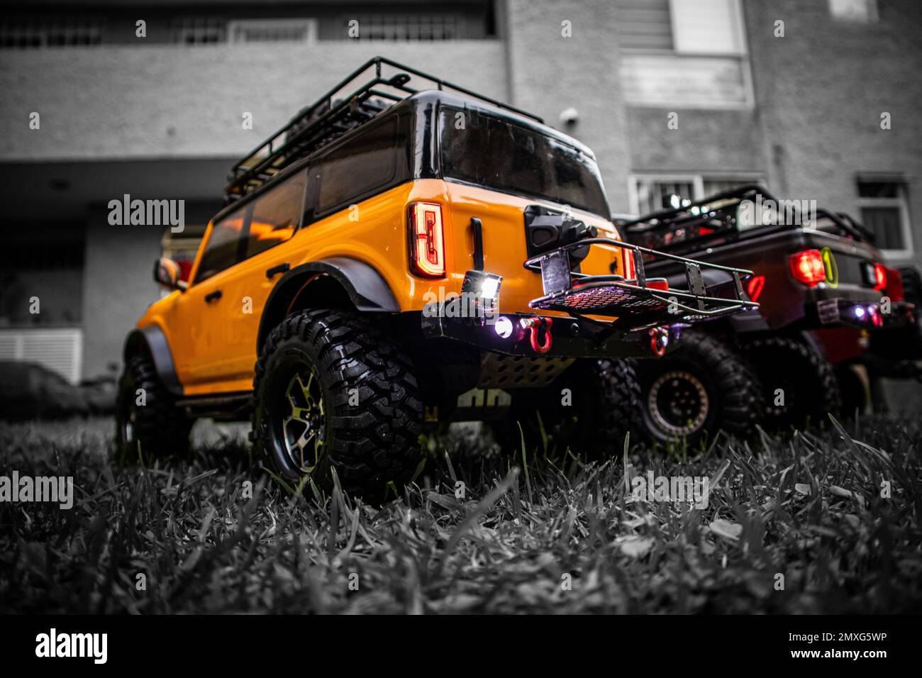 A selective color of a small figure-toy of a yellow car with remote ...