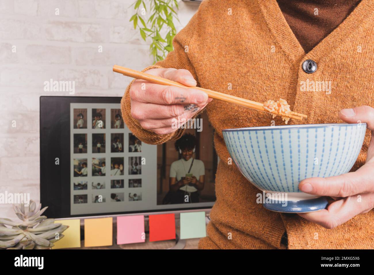 Close up of man enjoying chinese food at lunch break in office ...