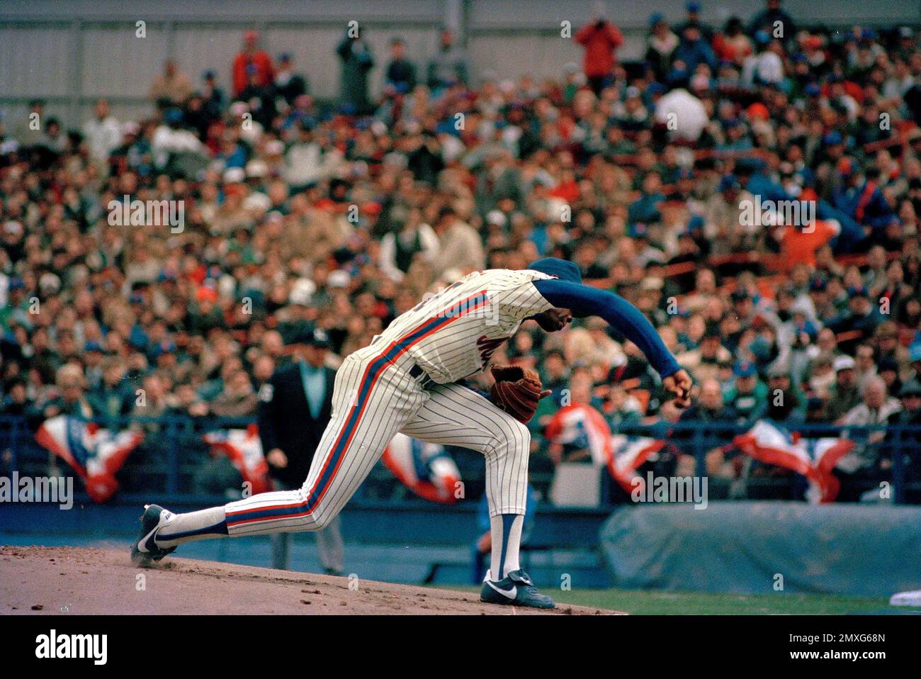 Dwight Gooden of the New York Mets pitches in the opening day game ...