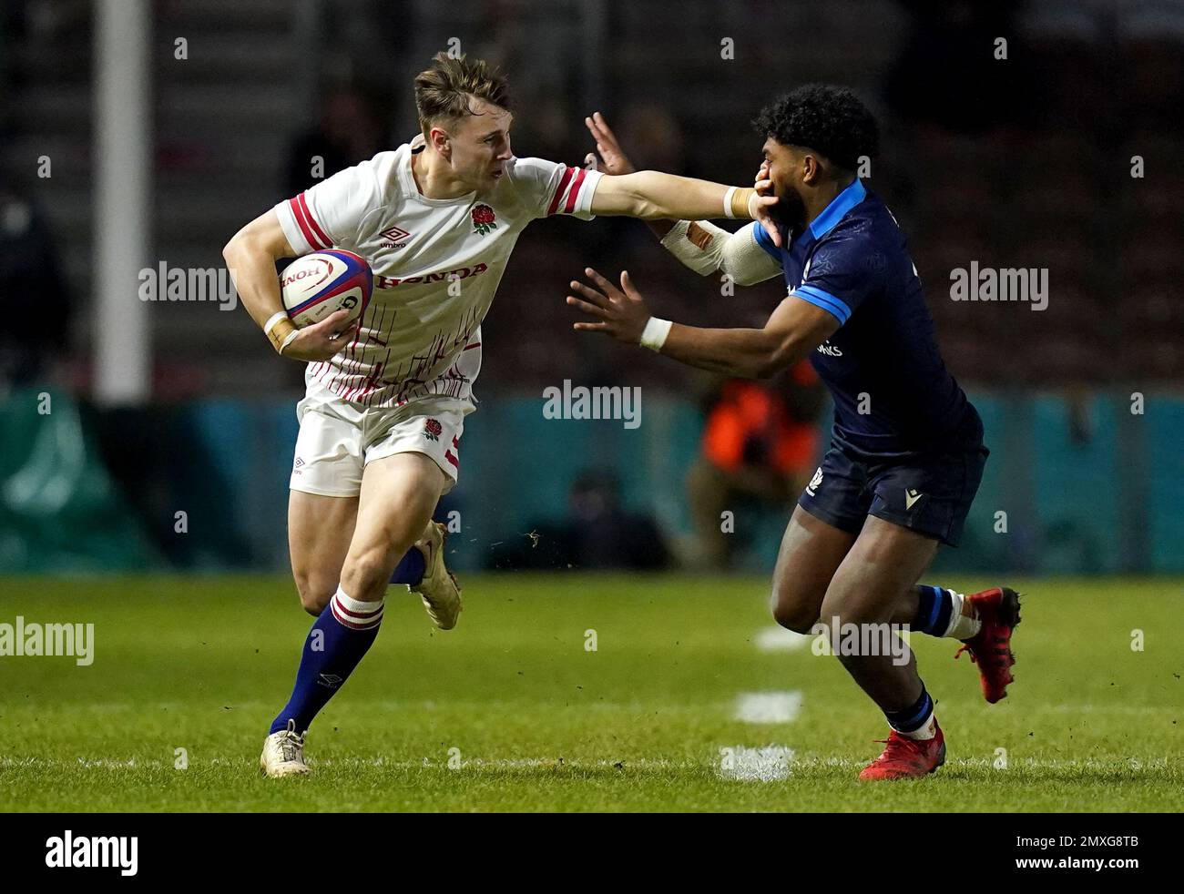 England’s Tobias Elliott gets past Scotland’s Amena Caqusau during the ...