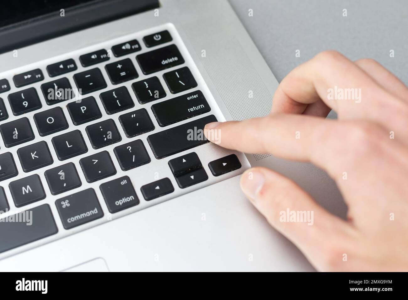 Pressing enter button on the computer keyboard Stock Photo - Alamy