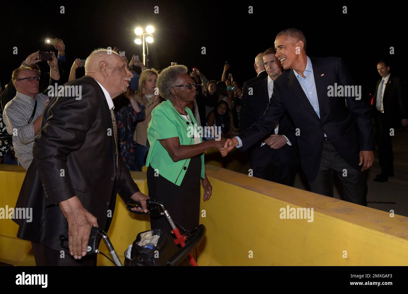 President Barack Obama, right, greets Silas Gross, left, and Dorothy ...
