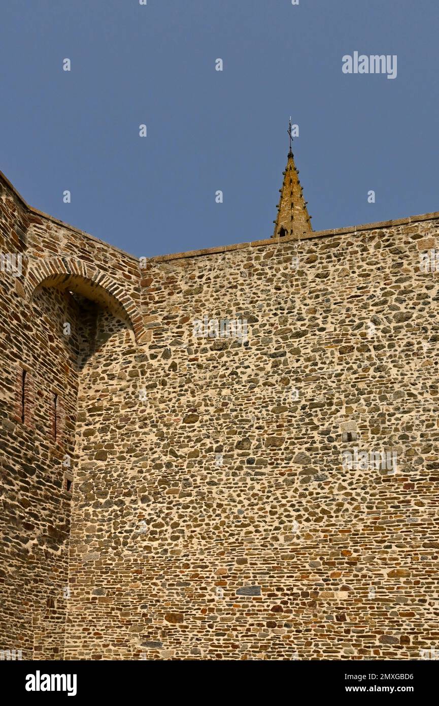 Details of the fortified walls of Granville, with the spire of Notre ...