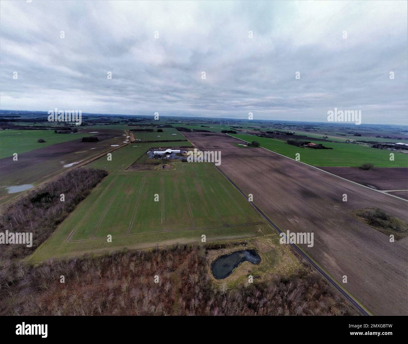An aerial view of cars driving on a highway near a field Stock Photo ...