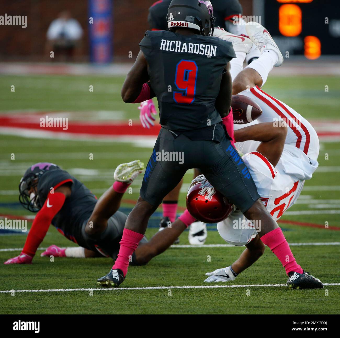 Houston wide receiver Chance Allen (21) fumbles after being hit by SMU ...